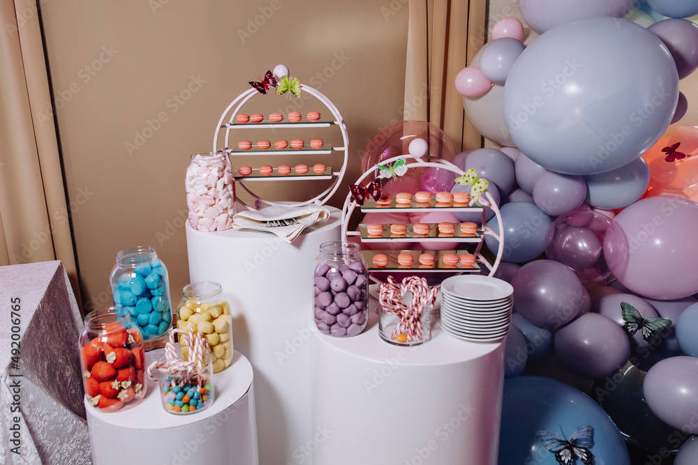 Luxury candy bar.Table with different sweets and cupcakes at a children ...