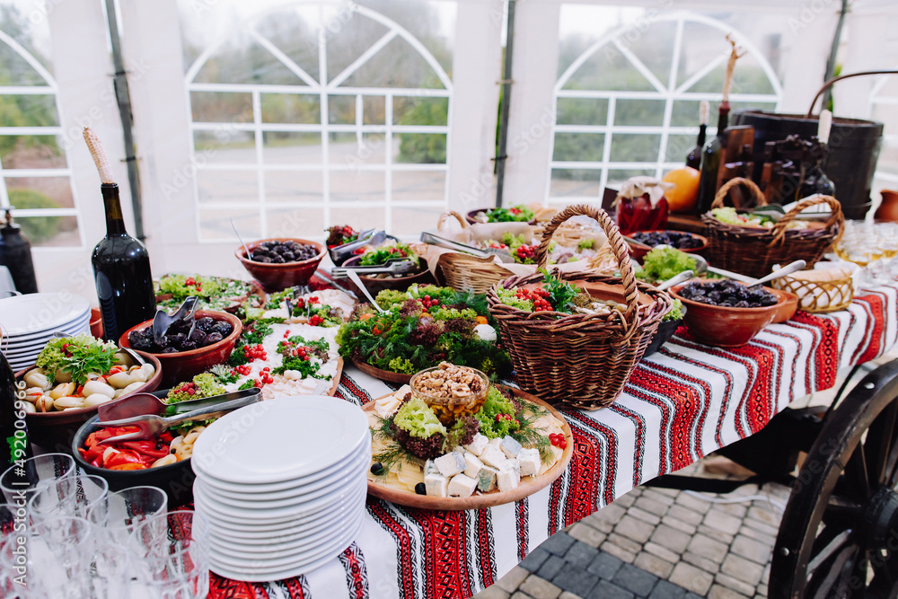 Ukrainian buffet table. Impressive buffet in the wedding hall. Cossack ...
