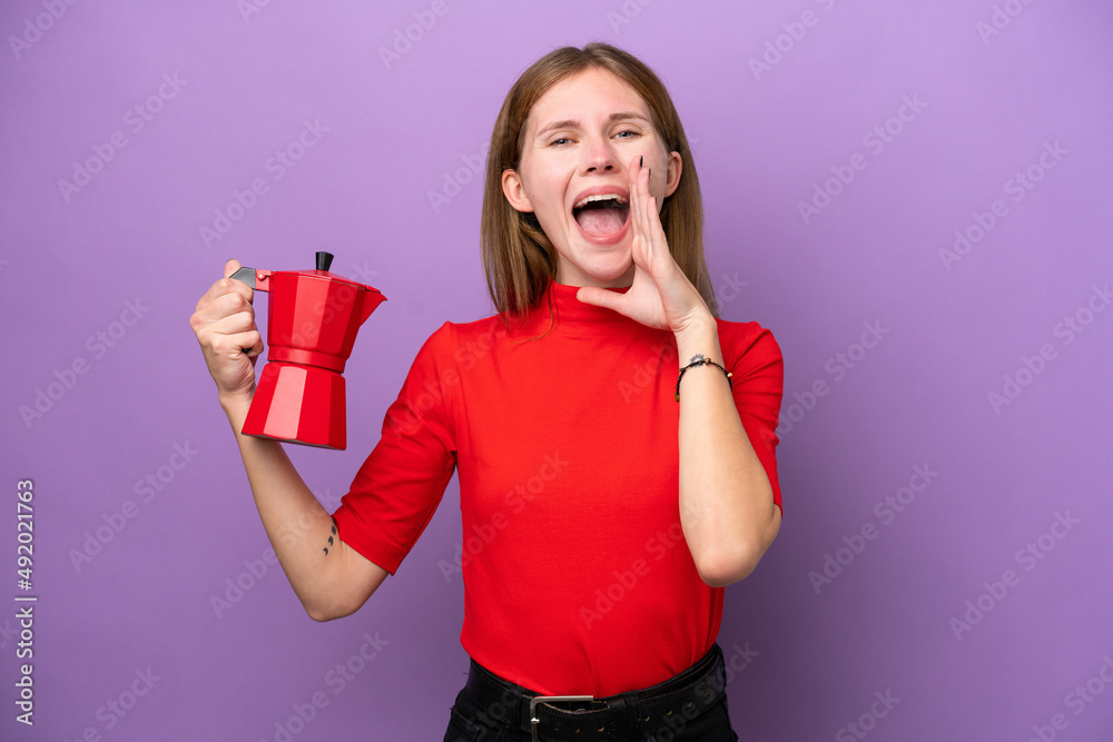 Young English woman holding coffee pot isolated on purple background ...