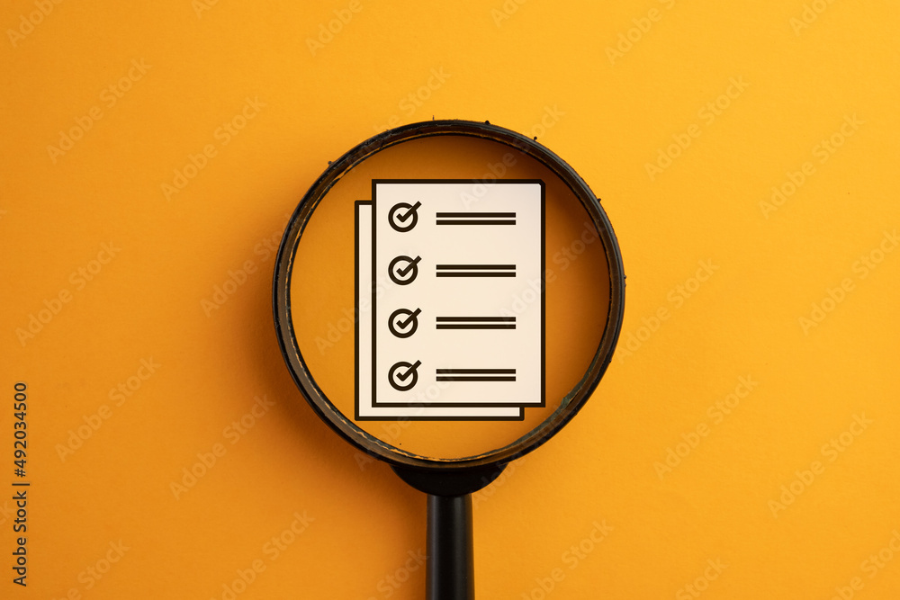 Checklist concept.,View through a magnifying glass on checklist paper ...