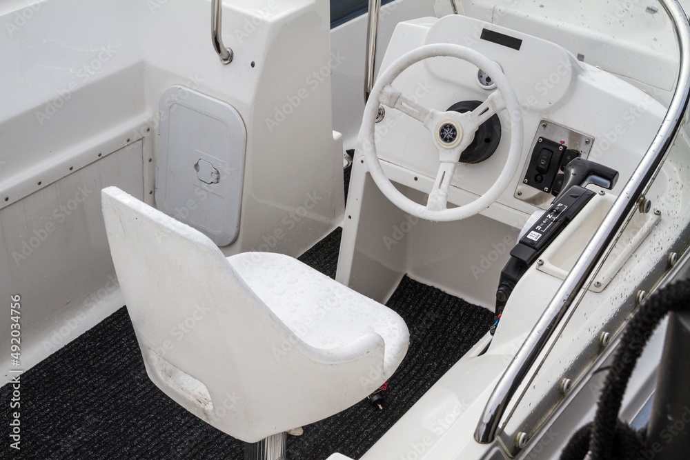 Empty cockpit in a motorboat. Speedboat dashboard with steering wheel ...