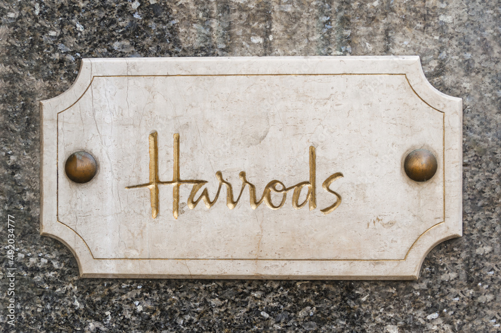 Harrods Shop plaque sign at the entrance. Logo on exterior of famous ...