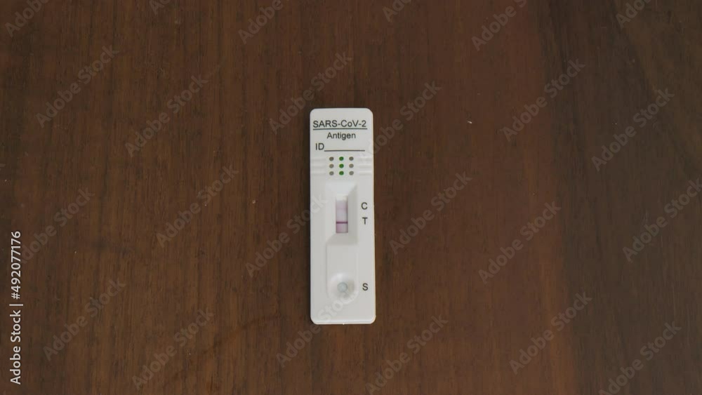 Liquid rises in a home rapid PCR test for coronavirus revealing a ...