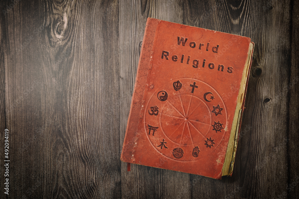 World religions book with symbols on wooden table top view Stock Photo ...