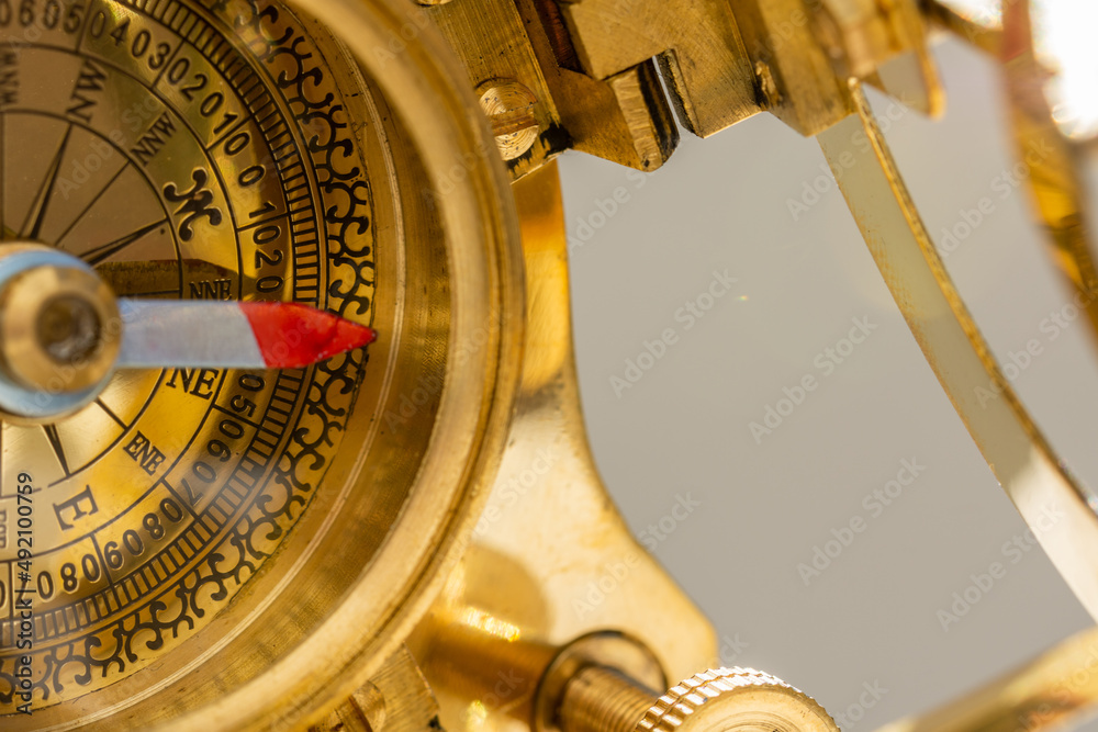 Detail of an antique maritime bronze solar compass Stock Photo | Adobe ...