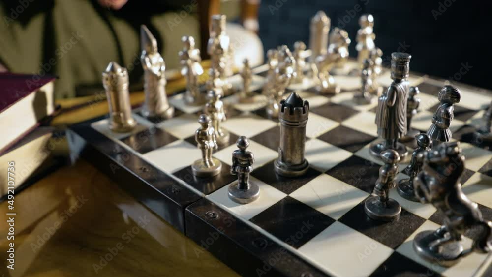 Chess game. Strategy sports game. Chess board with chess pieces. Metal ...