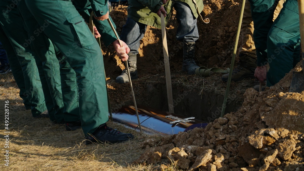 Funeral ceremony. People come to say goodbye. Burial in the grave ...