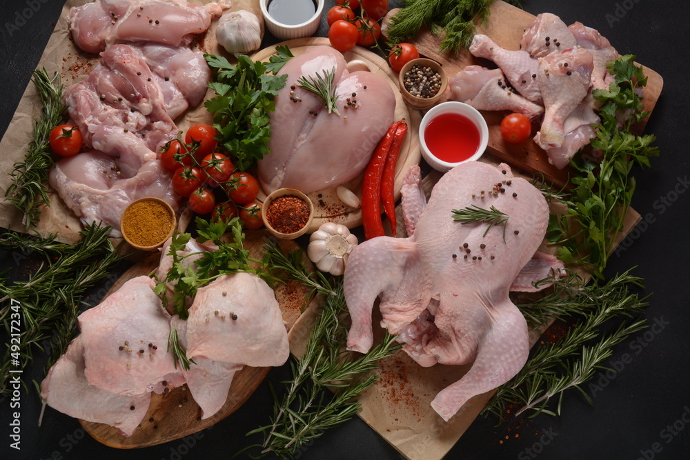 Different types of fresh chicken meat. Whole raw chicken, fillet, thigh ...