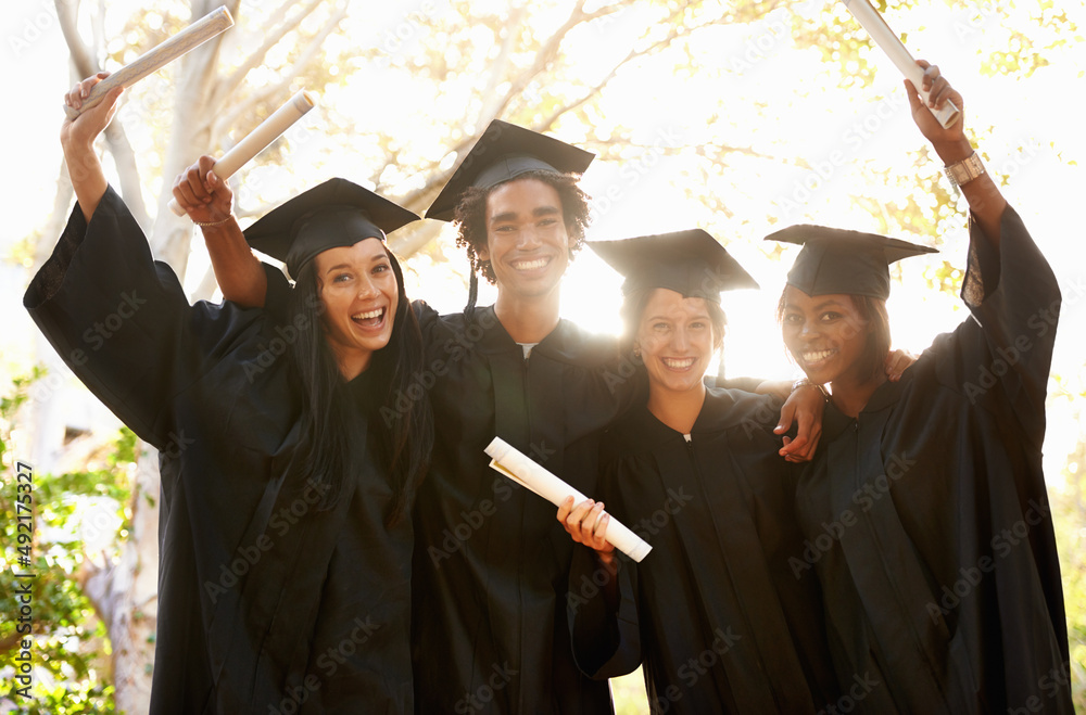 Positive theyre going places. A group of smiling college graduates ...