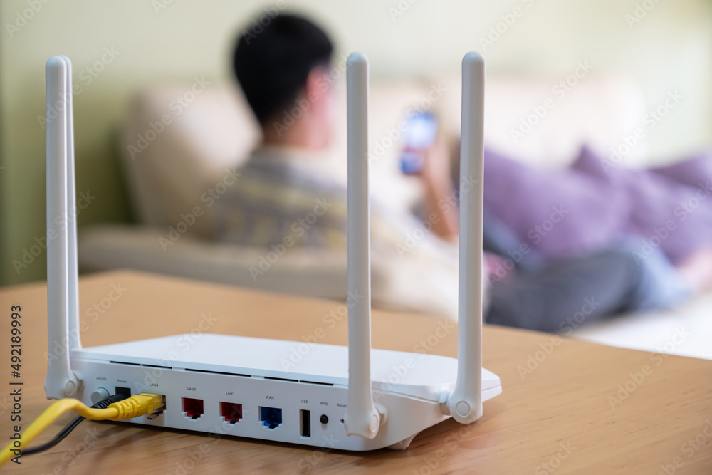 Selective focus at router. Internet router on working table with ...