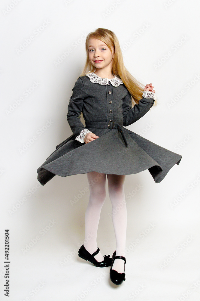 Plakát little girl posing in school uniform – Obraz na Zeď | Posters.cz