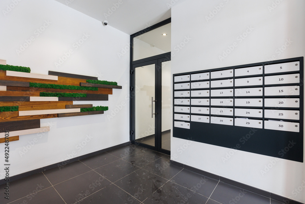 mailboxes in the lobby of an apartment building Stock Photo | Adobe Stock