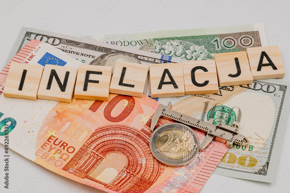 Napis inflacja na tle banknotów Stock Photo | Adobe Stock