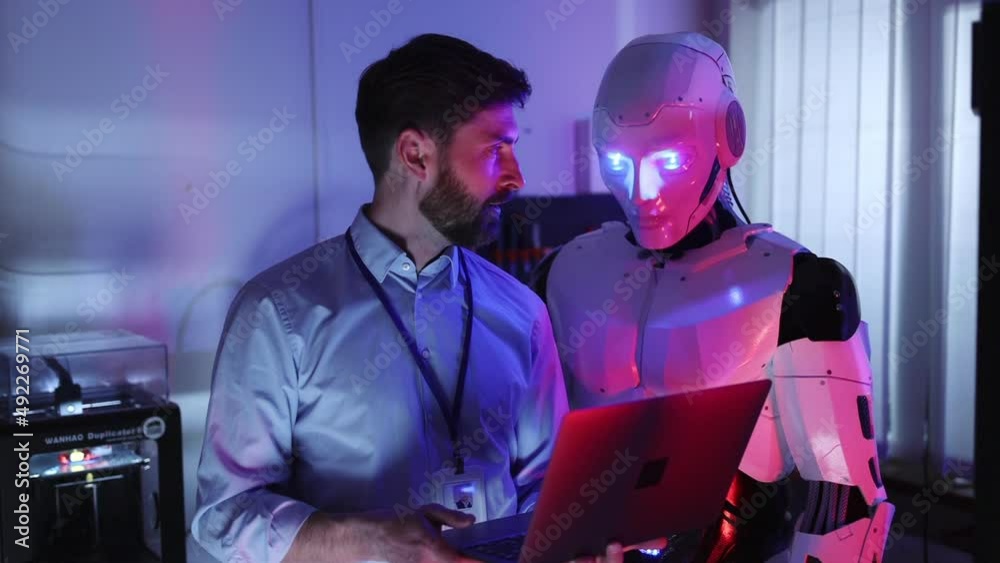 Cooperative couple office businessman and robot celebrating successful ...