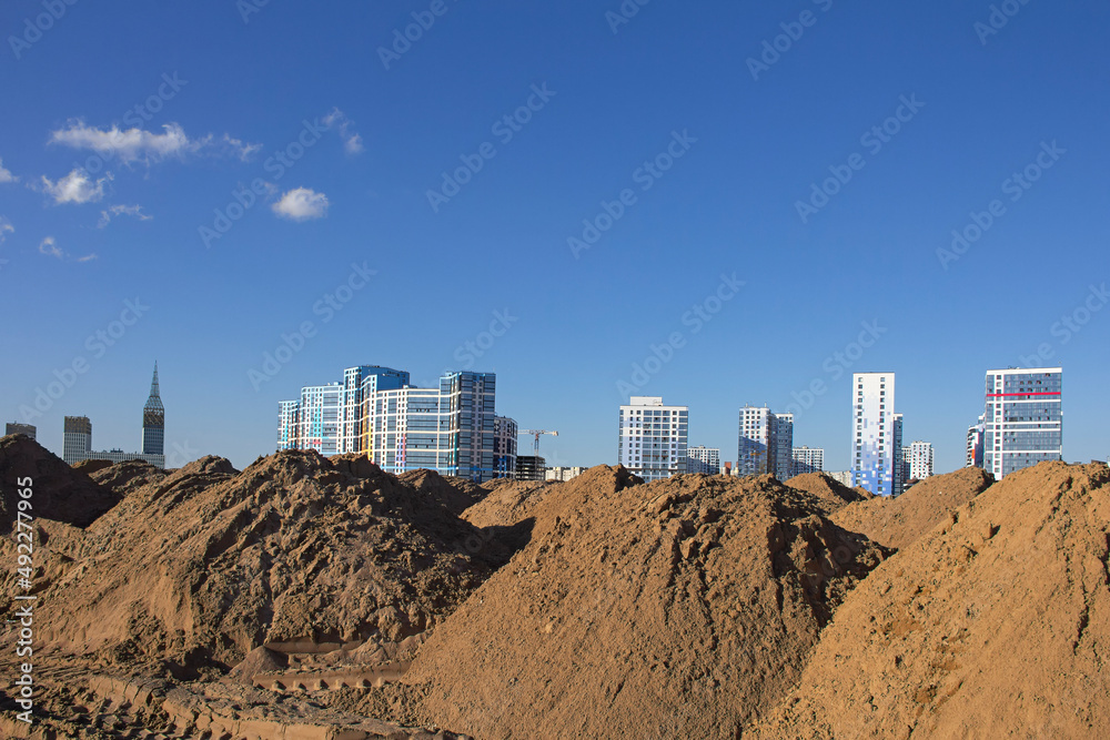 The sand mound for construction and the Construction site of new multi ...