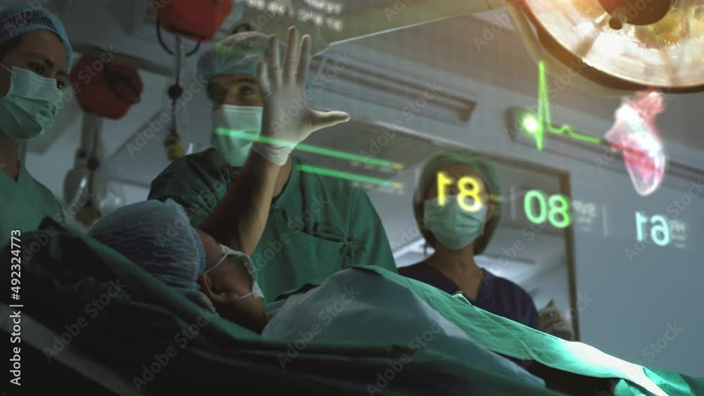 Vidéo Stock Futuristic simulation operating room - a surgeon diagnosing ...