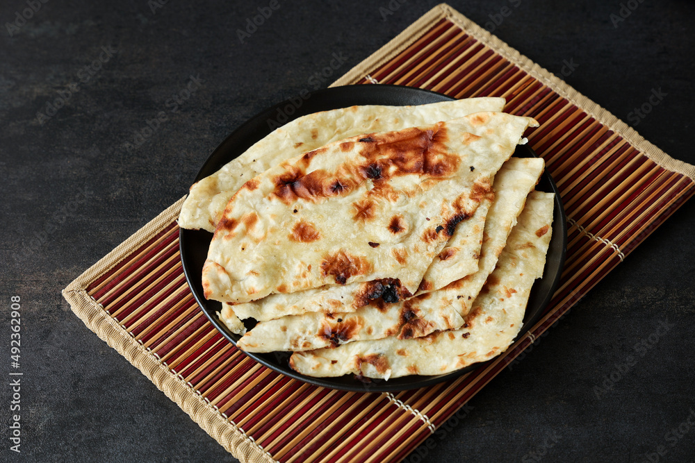 Tandoori Roti whole wheat flat bread with Indian curry butter chicken ...