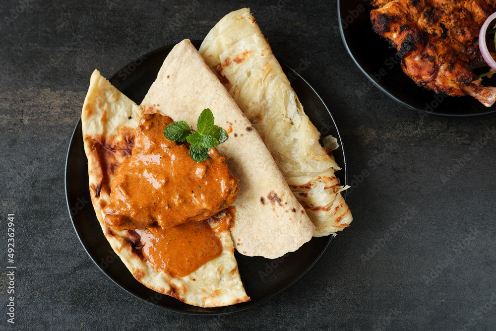 Butter chicken curry with naan Murg Makhanwala roti paratha porotta ...