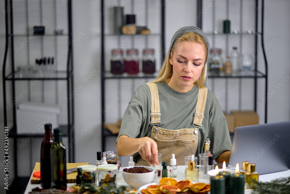 fragrance a on table with many bottles of essential oil is testing ...
