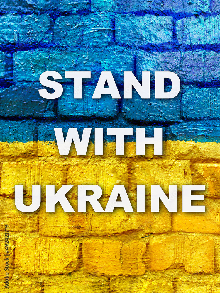 slogan Stand with Ukraine on painted Ukrainian flag Stock Photo | Adobe ...