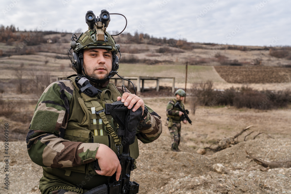 Foto de Two men front view portrait of soldiers in camouflage uniform ...