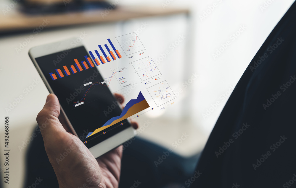 Mobile phone with chart. Investment in business and financial concept ...