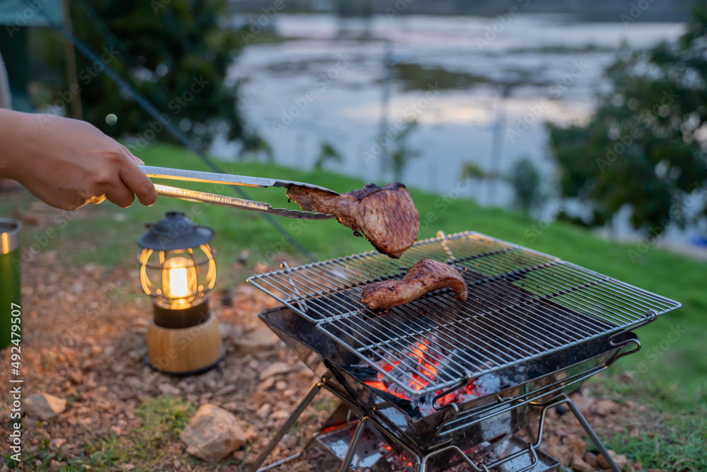 Cooking food during camping at natural park in Thailand. Recreation and ...