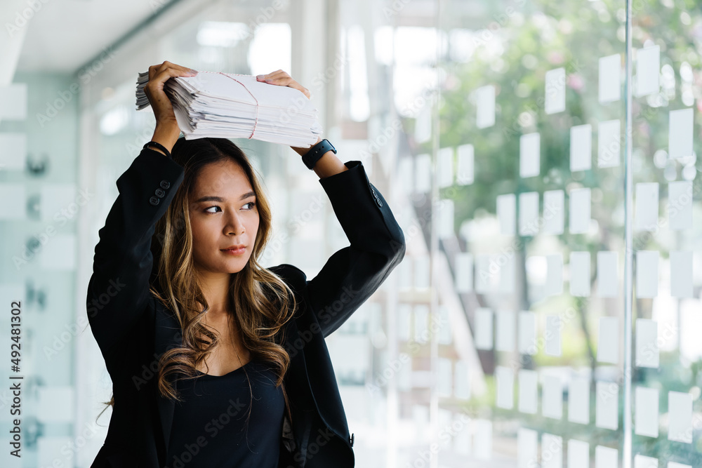 Employee Asian woman hands holding Stacks paper files over head in ...