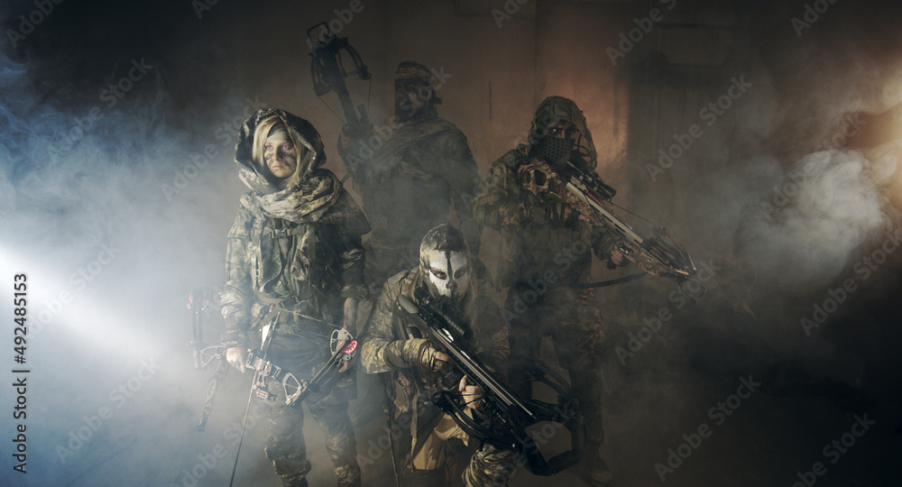 apocalypse fighters. a girl with a bow and a guy with crossbows. Stock ...