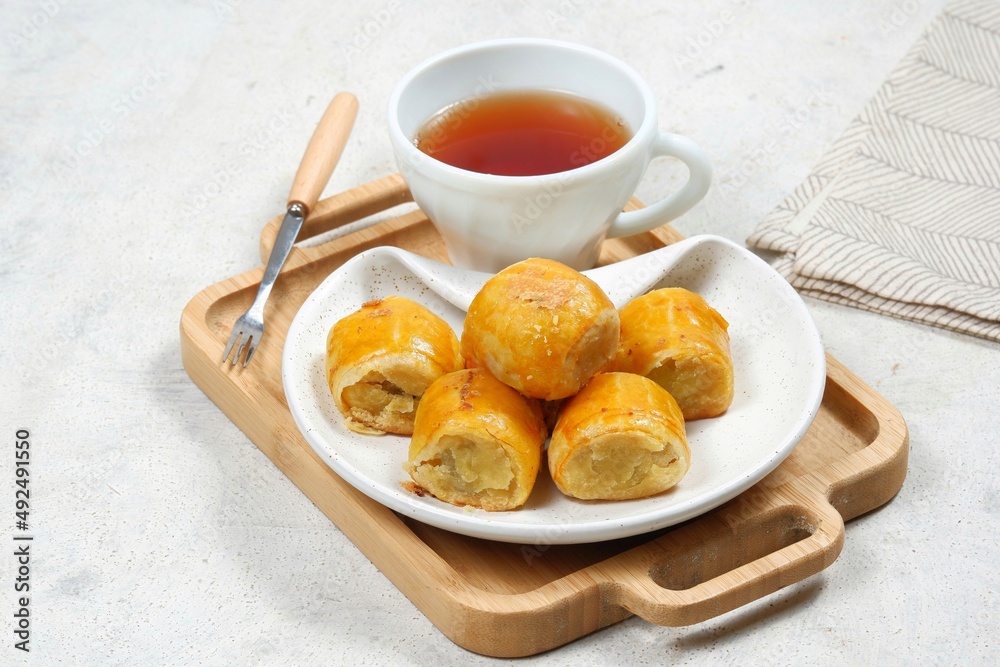 Bolen pisang or banana bolen is a snack made from bananas wrapped in ...