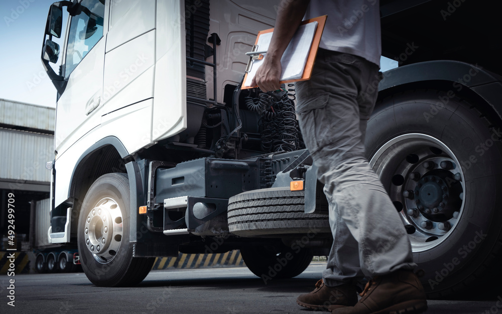 Truck Driver is Checking the Truck's Safety Maintenance Checklist ...