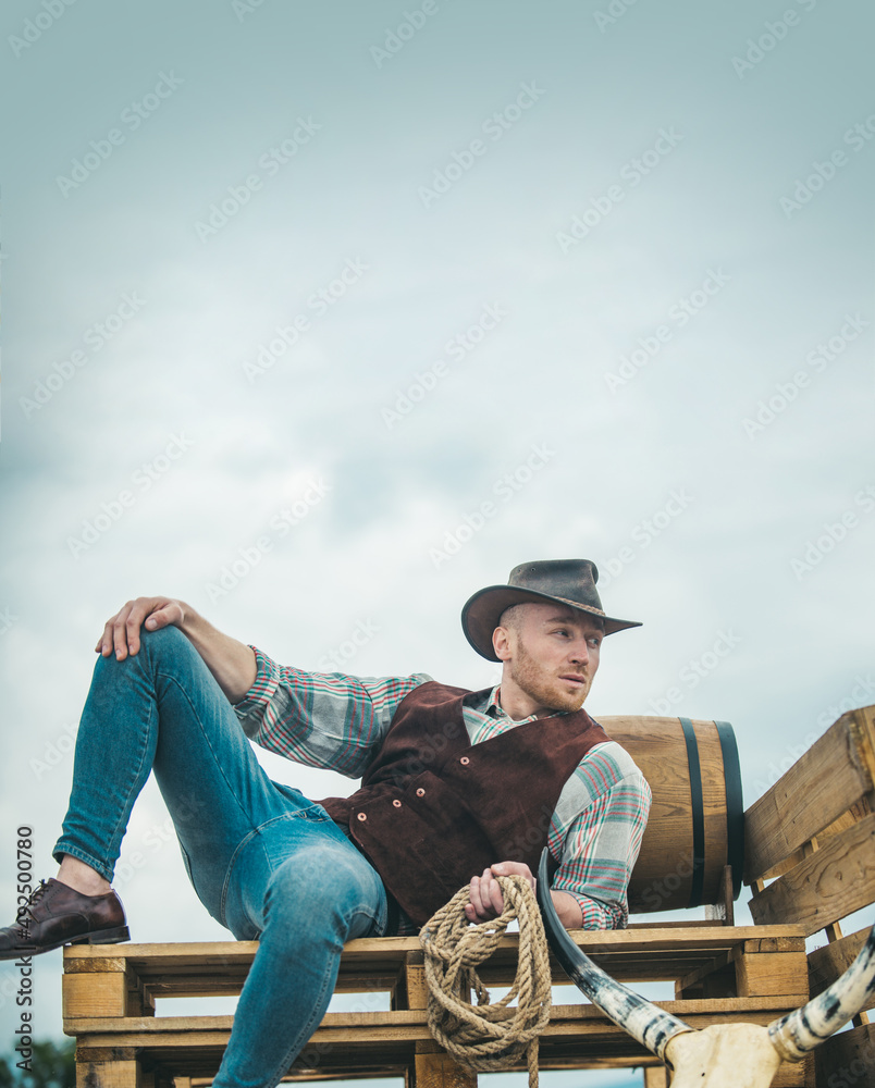Cowboy farmer man in country side wearing western cowboy hat. American ...