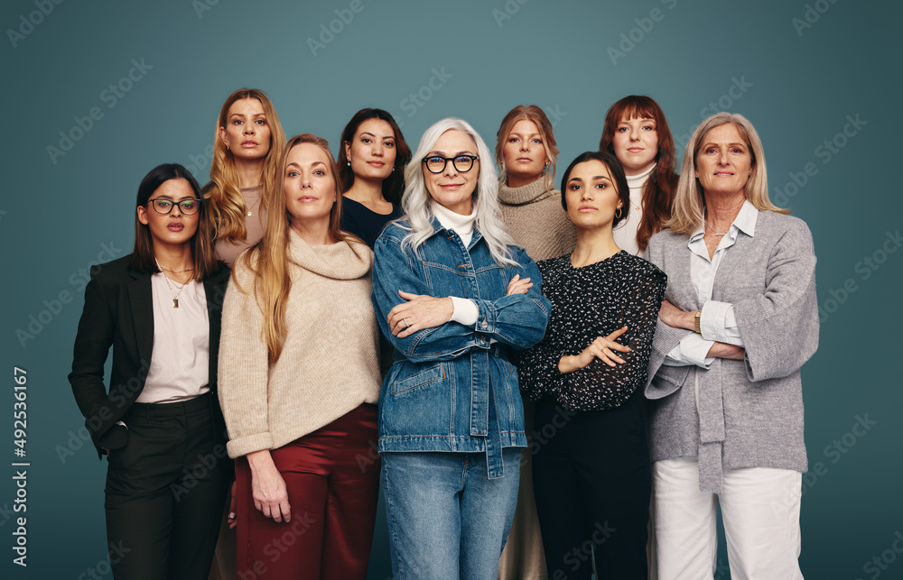 Strong women of different ages standing together in a studio Stock ...