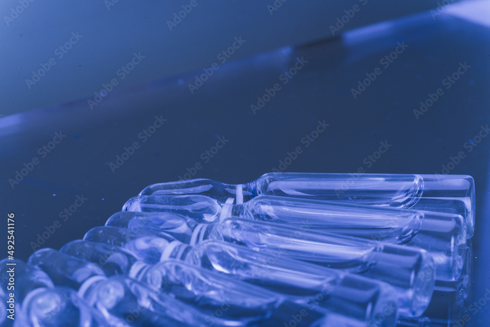 Glass medical ampoule vial for injection. Medicine is liquid sodium ...