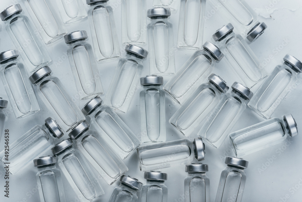 Glass medical ampoule vial for injection. Medicine is dry white drug ...