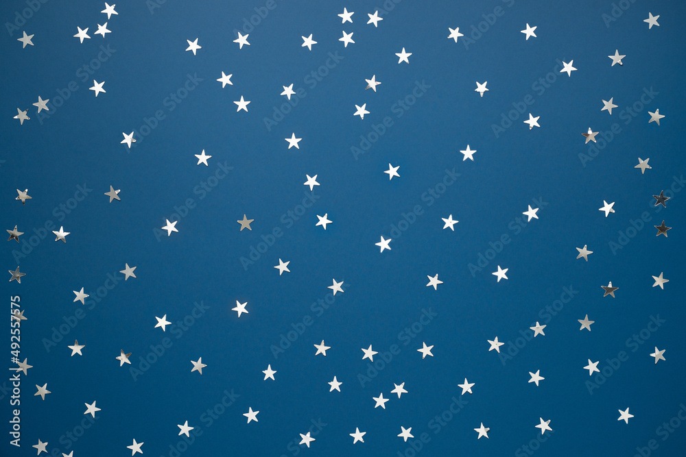 blue background with silver stars confetti. Night sky minimalism ...