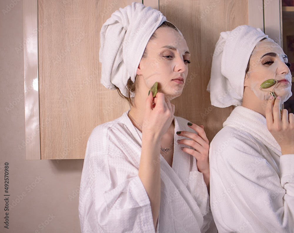 Close-up portrait of a young beautiful girl, dark hair, a white towel ...
