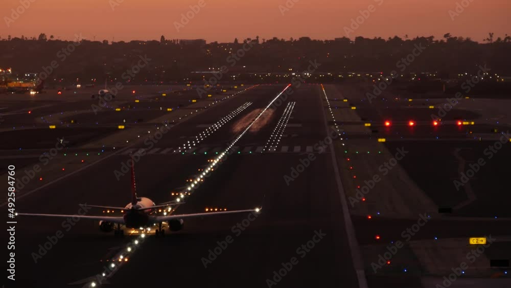 Airport runway lights at night, plane or airplane taking off from ...