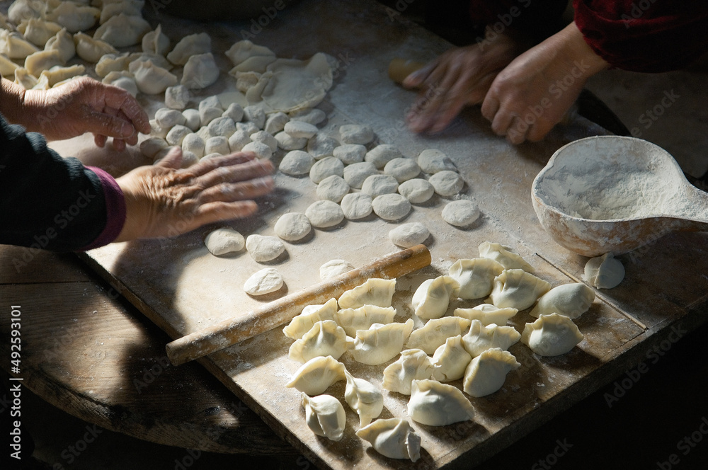 Making traditional dim sum Chinese dumplings. Meat dough pastry and ...
