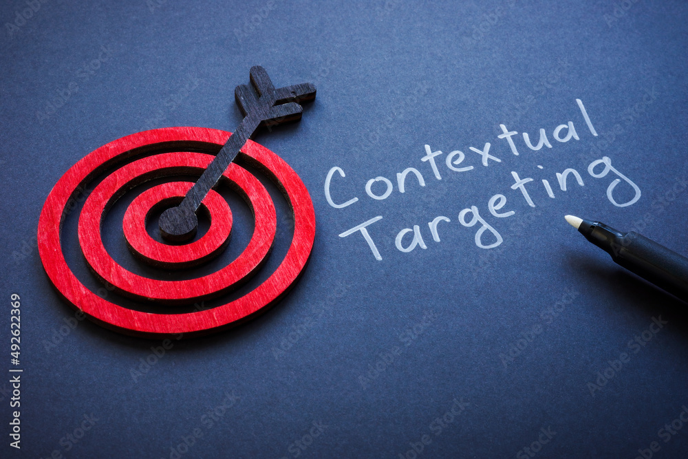 Handwritten contextual targeting and a target as symbol. Stock Photo ...