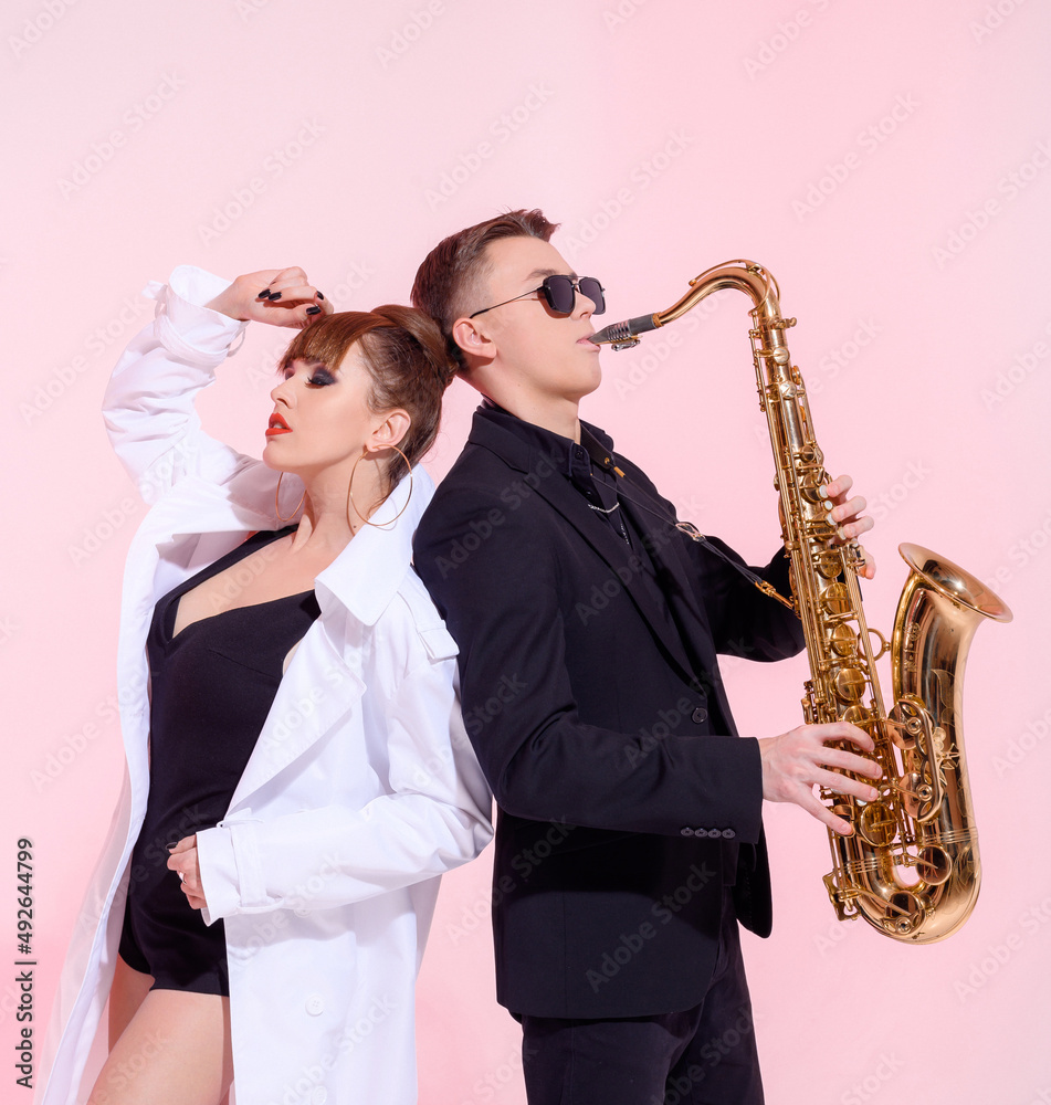 Side view of stylish female singer with smoky eyes makeup and red lips ...