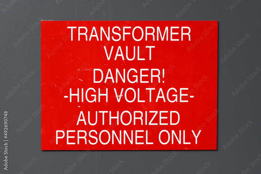 Red sign with white letter informing Transformer Vault Danger, High ...