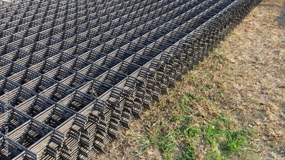 Wire mesh steel grid. BRC welded wire mesh piles on the ground for slab ...