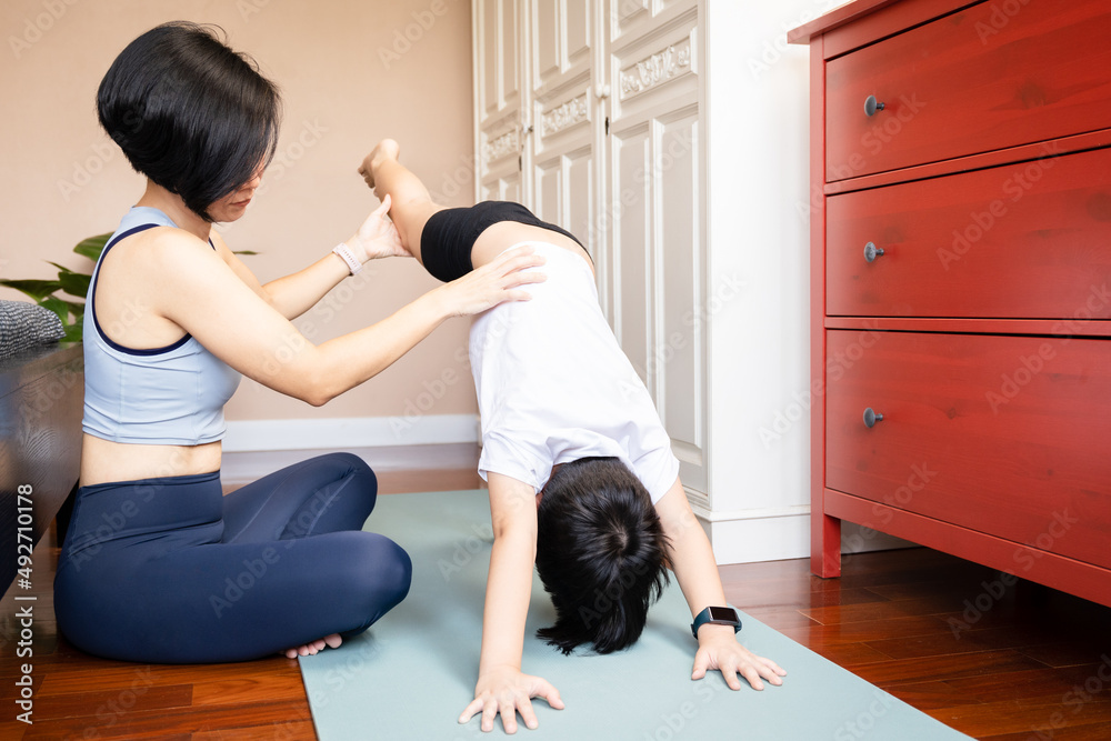 Kids Yoga, Family home exercise concept. A beautiful asian mother ...