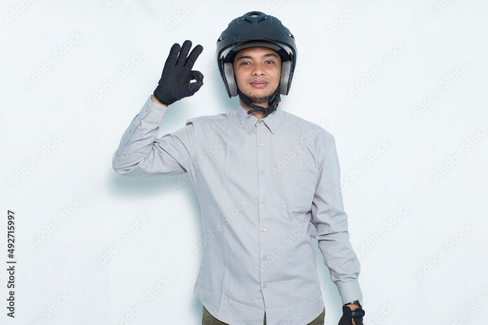 handsome asian man with a motorcycle helmet showing a thumbs up ok ...