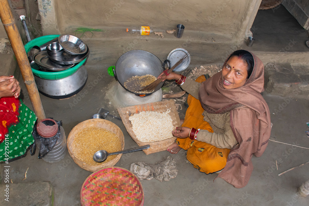 Rural Indian Woman cooking food in the Kitchen using firewood stove ...