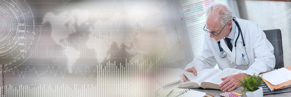 Doctor reading a textbook; panoramic banner Stock Photo | Adobe Stock