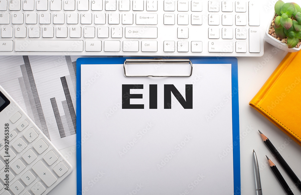 EIN - Employer Identification Number written on paper with keyboard ...