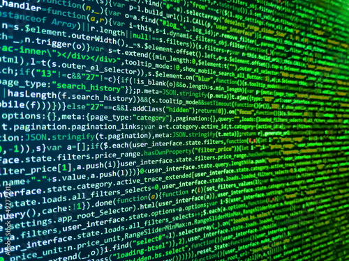 HTML CSS3 source code on lcd screen with black background. Programming code abstract background ...