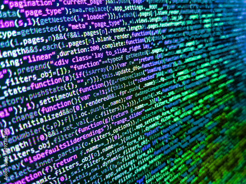 HTML CSS3 source code on lcd screen with black background. Programming code abstract background ...